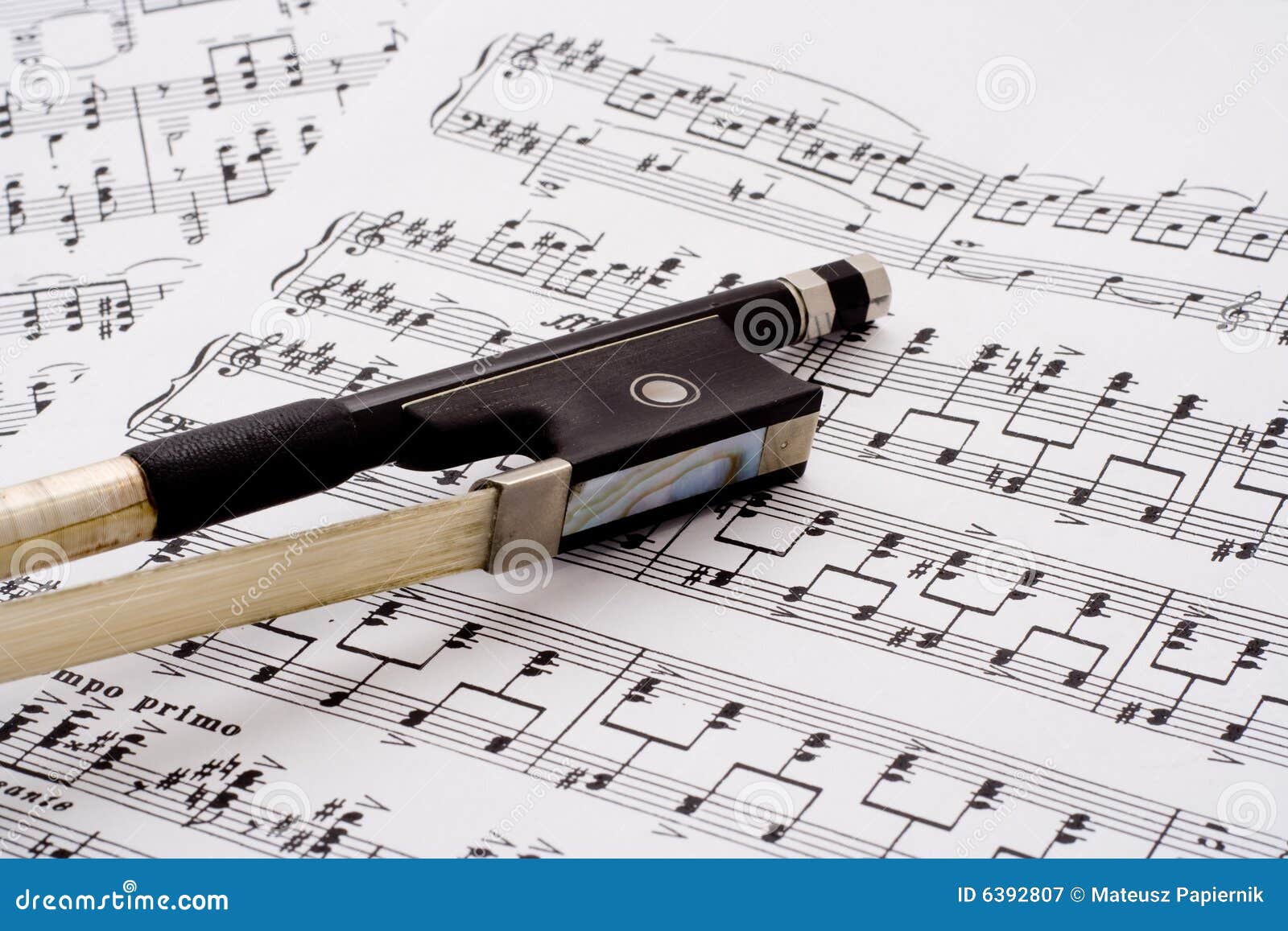 Violin bow on sheet music stock image. Image of violin - 6392807
