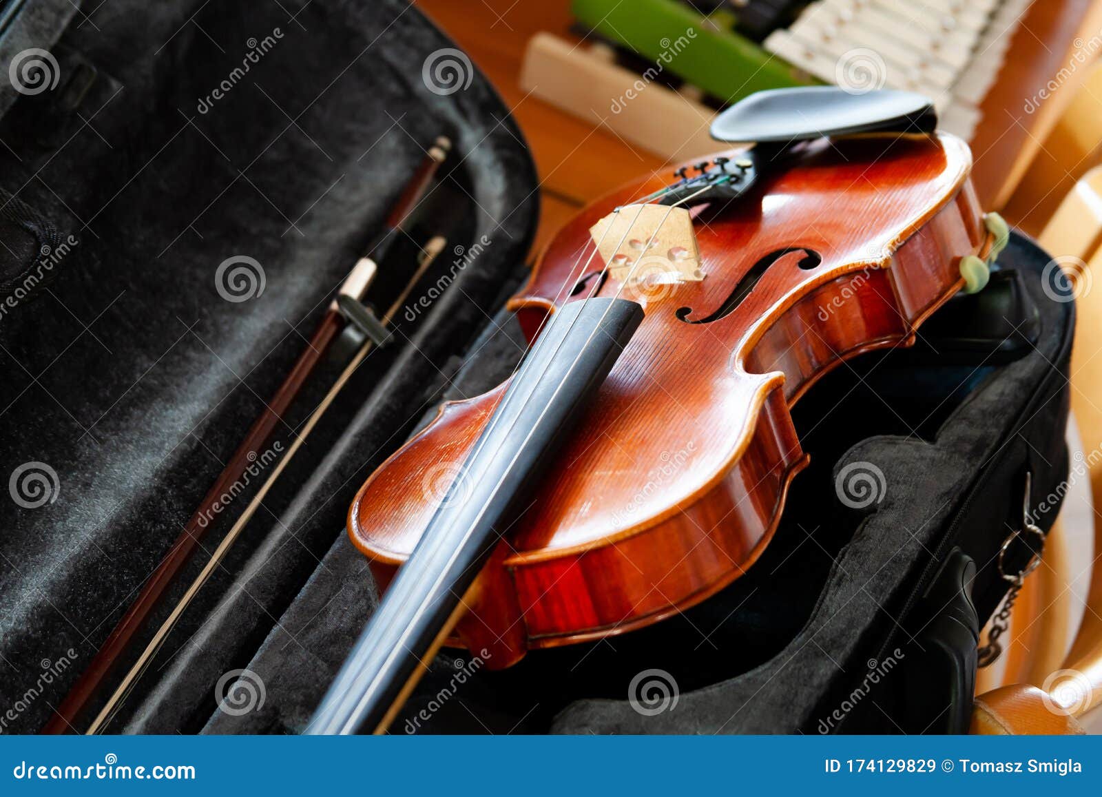 Violin, Fiddle with a Bow Laying in an Open Black Case on the Table ...