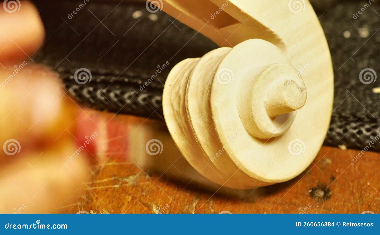 Violinmaker Carving a New Violin Scroll with Knife by Hand Stock ...