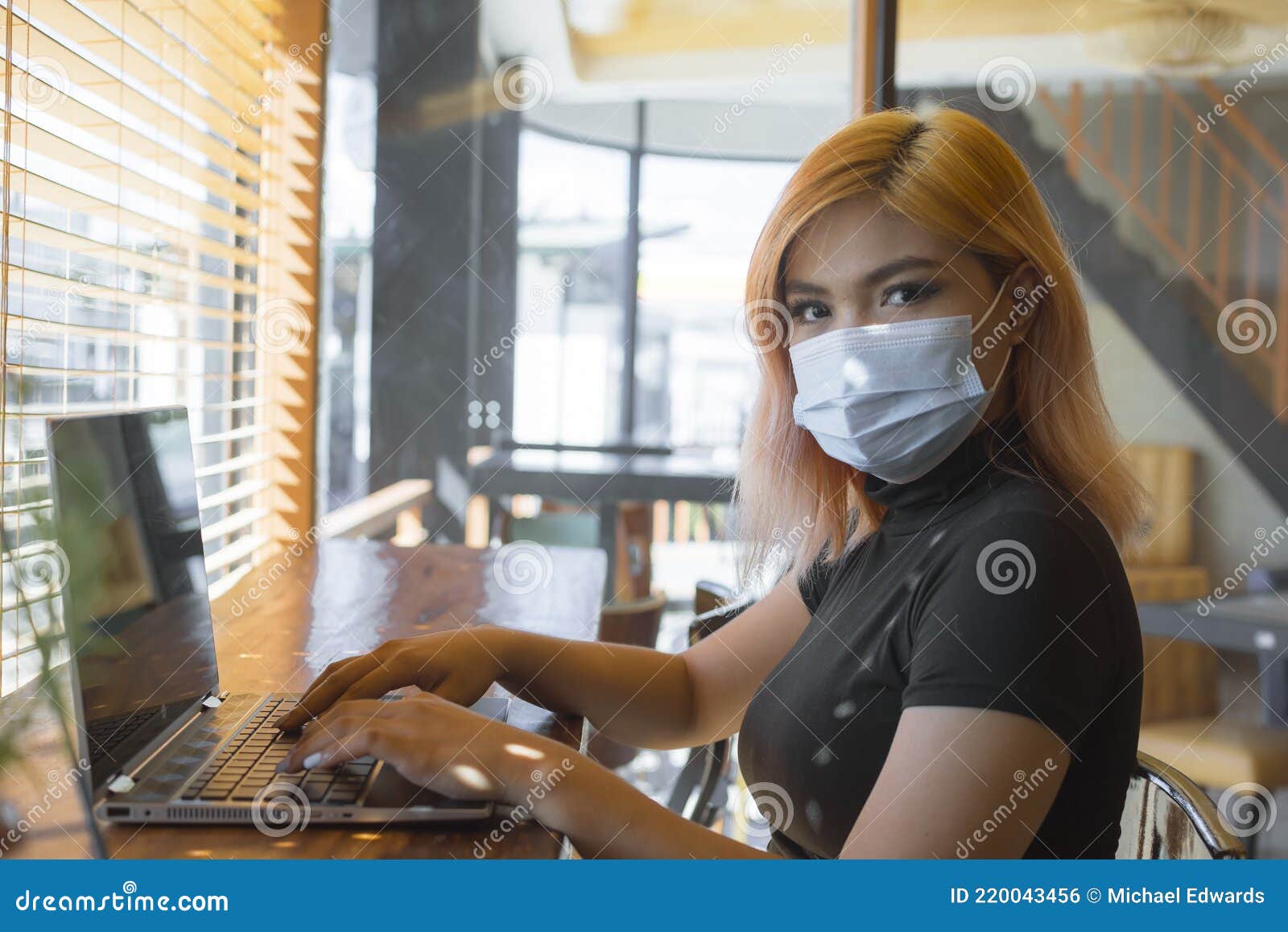 A Virtual Assistant with a Face Mask Working Remotely at an Uncrowded ...