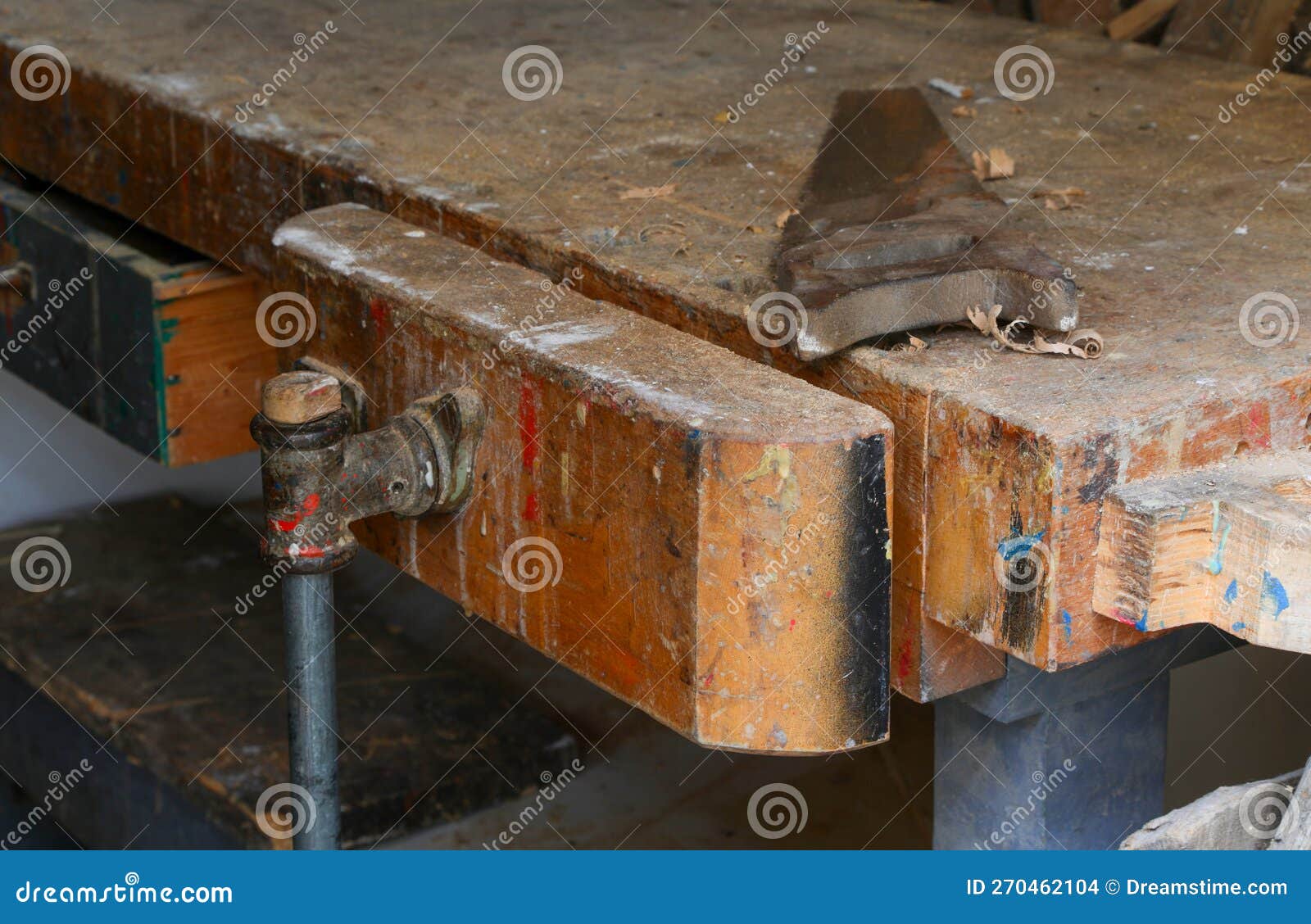 Vise in the Workbench of an Artisan Carpentry and a Saw with a Toothed ...