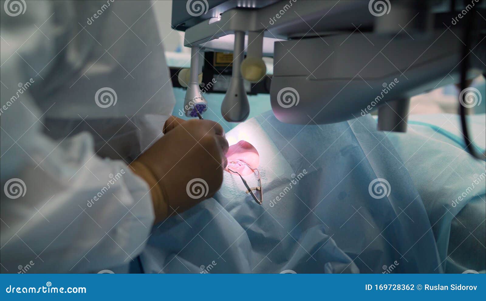 Eye Surgeon Operating Woman with Laser Vision Correction Machine in the ...