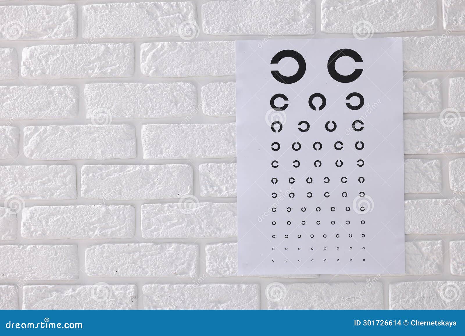 Vision Test Chart on White Brick Wall, Space for Text Stock Photo ...