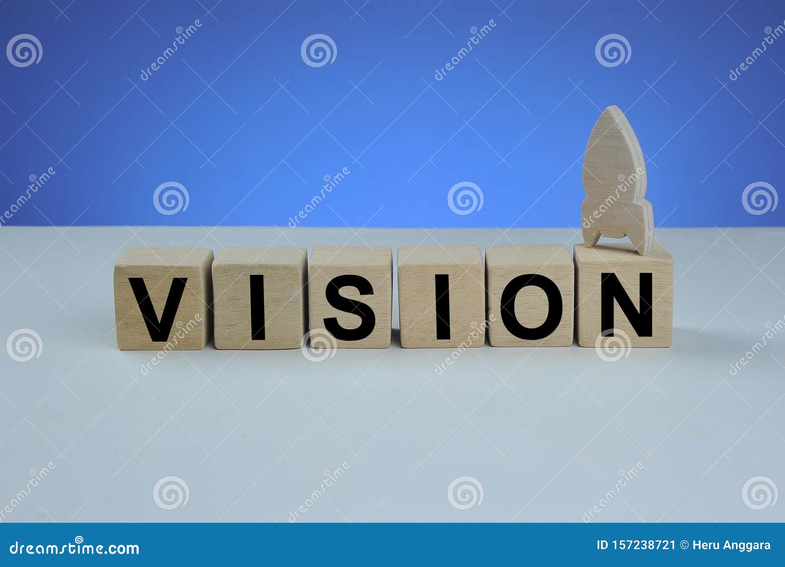 Vision Word Written on Wood Cube. with Blue Background Stock Image ...