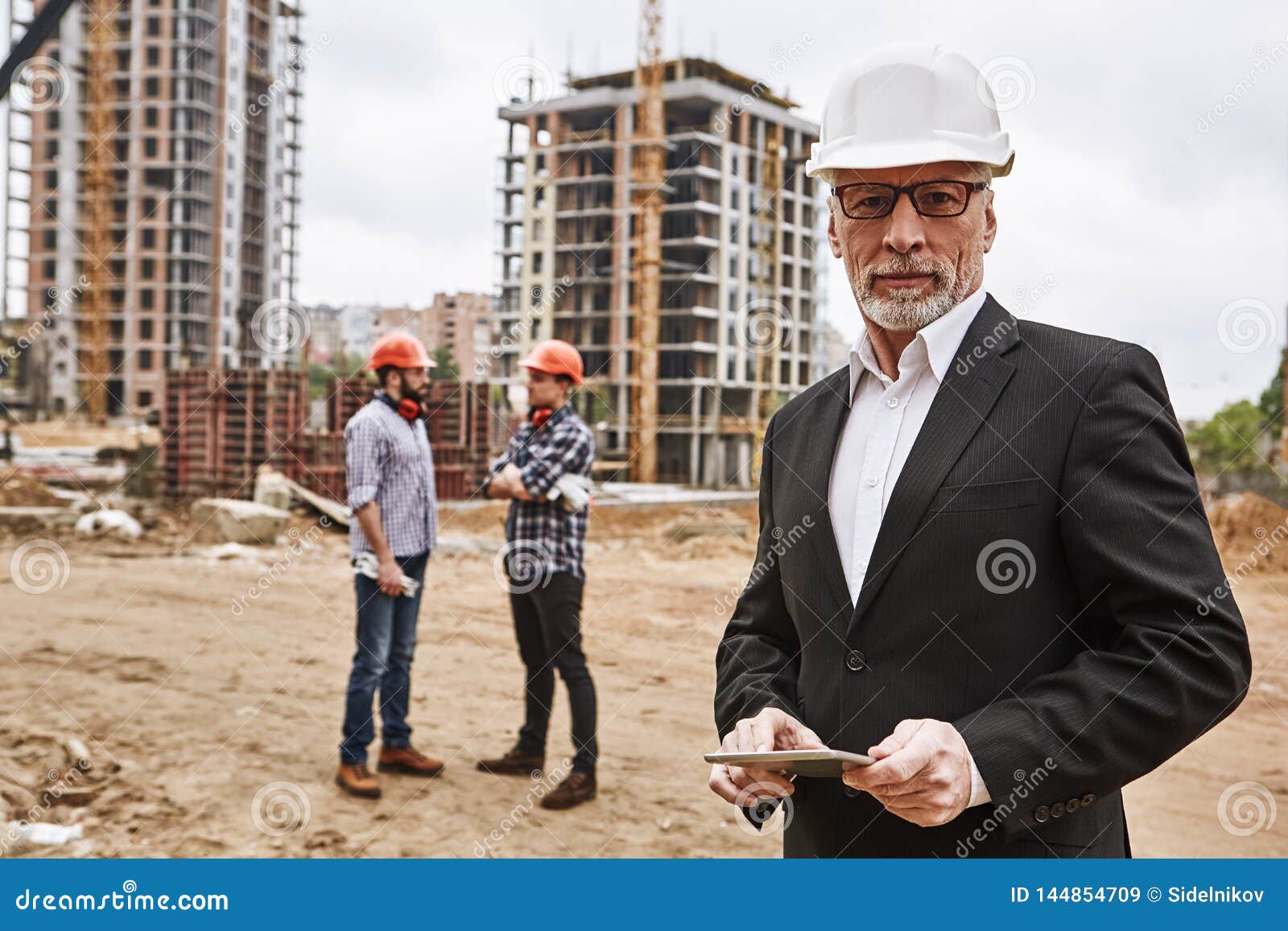 Visiting Construction Site. Portrait of Confident Elderly Construction ...