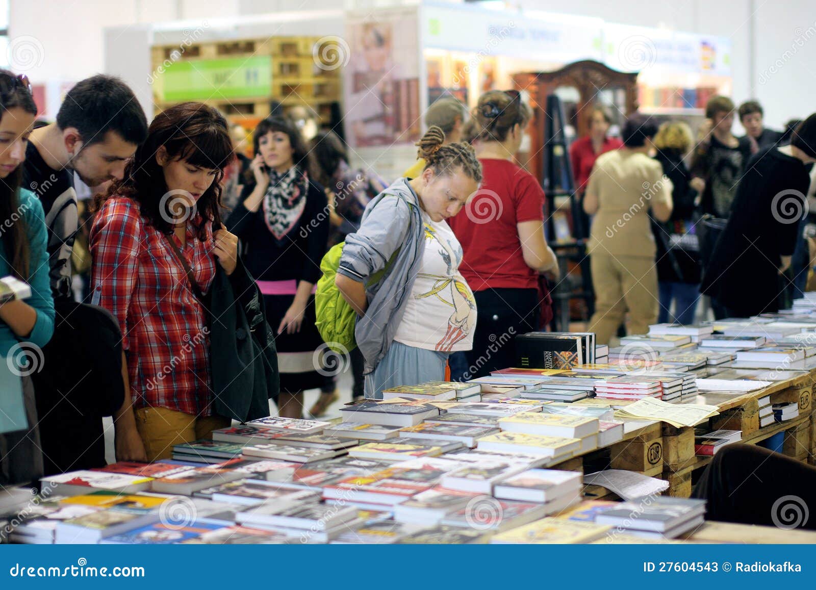 Visitors of the book fair editorial stock photo. Image of female - 27604543