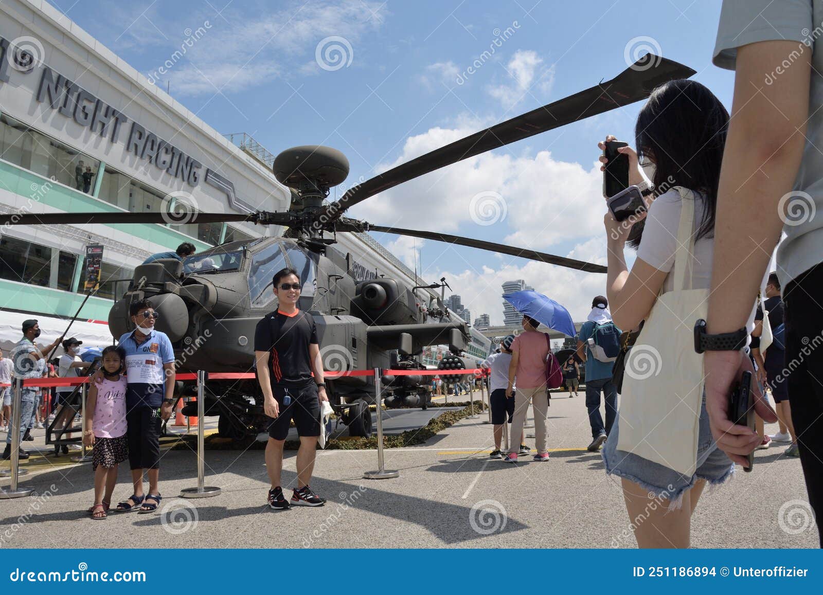 Visitors Posing and Taking Photos with the Apache Longbow Combat ...