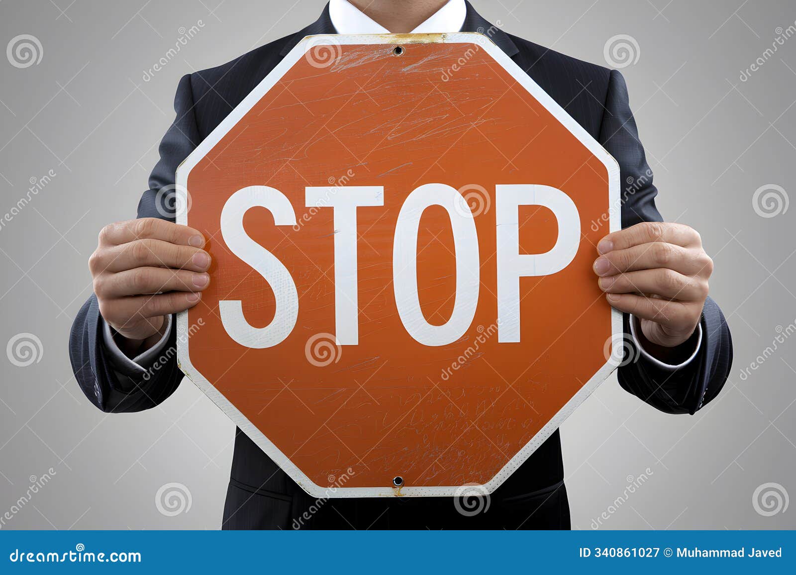 Man Holds Worn Red STOP Sign, Standing Against Gradient Gray Background ...