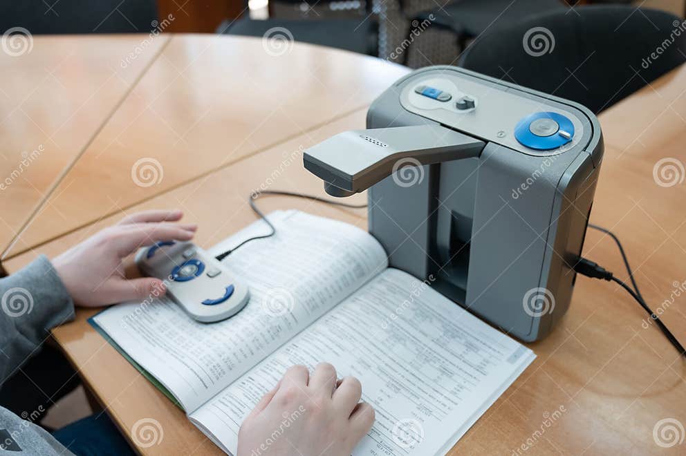 A Visually Impaired Man Uses a Scanning and Reading Machine. Stock ...