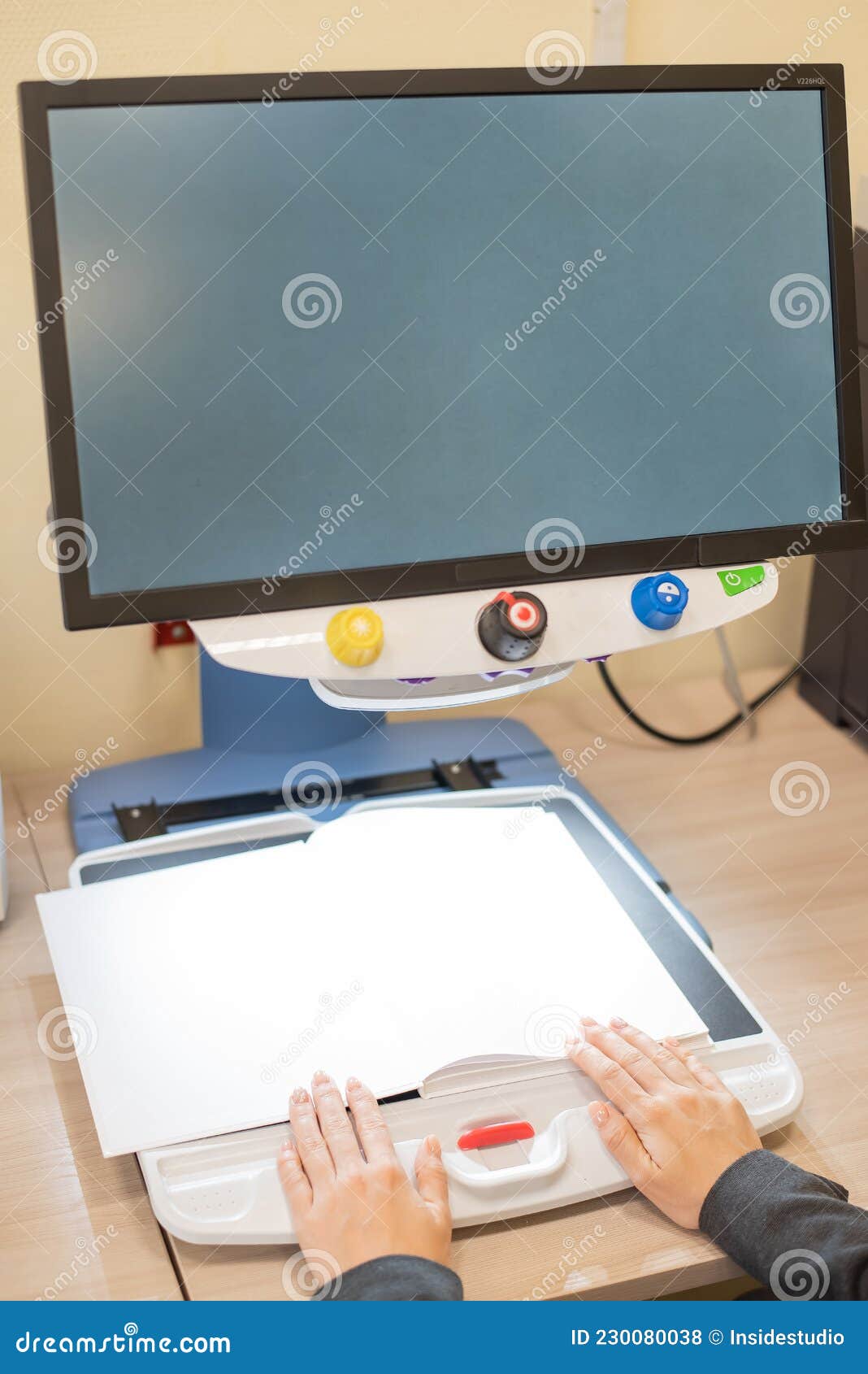A Visually Impaired Woman Uses Special Reading Equipment Stock Photo ...