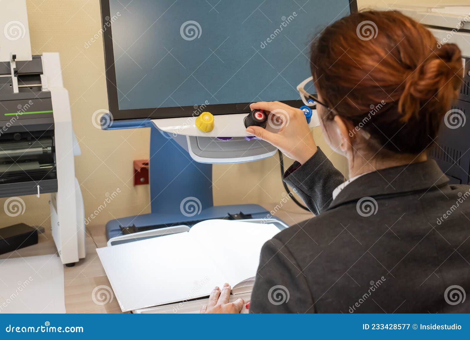 A Visually Impaired Woman Uses Special Reading Equipment Stock Image ...