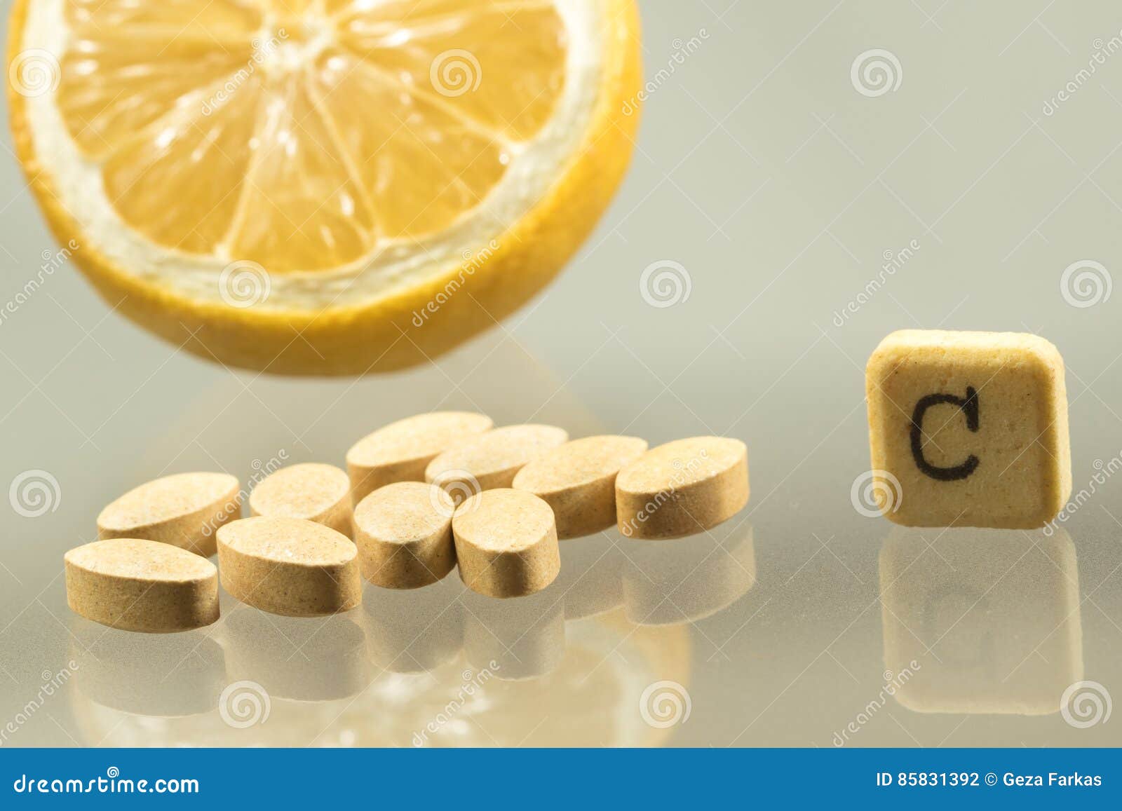 Vitamin C Pill and Lemon on White Stock Photo - Image of pharmaceutical ...