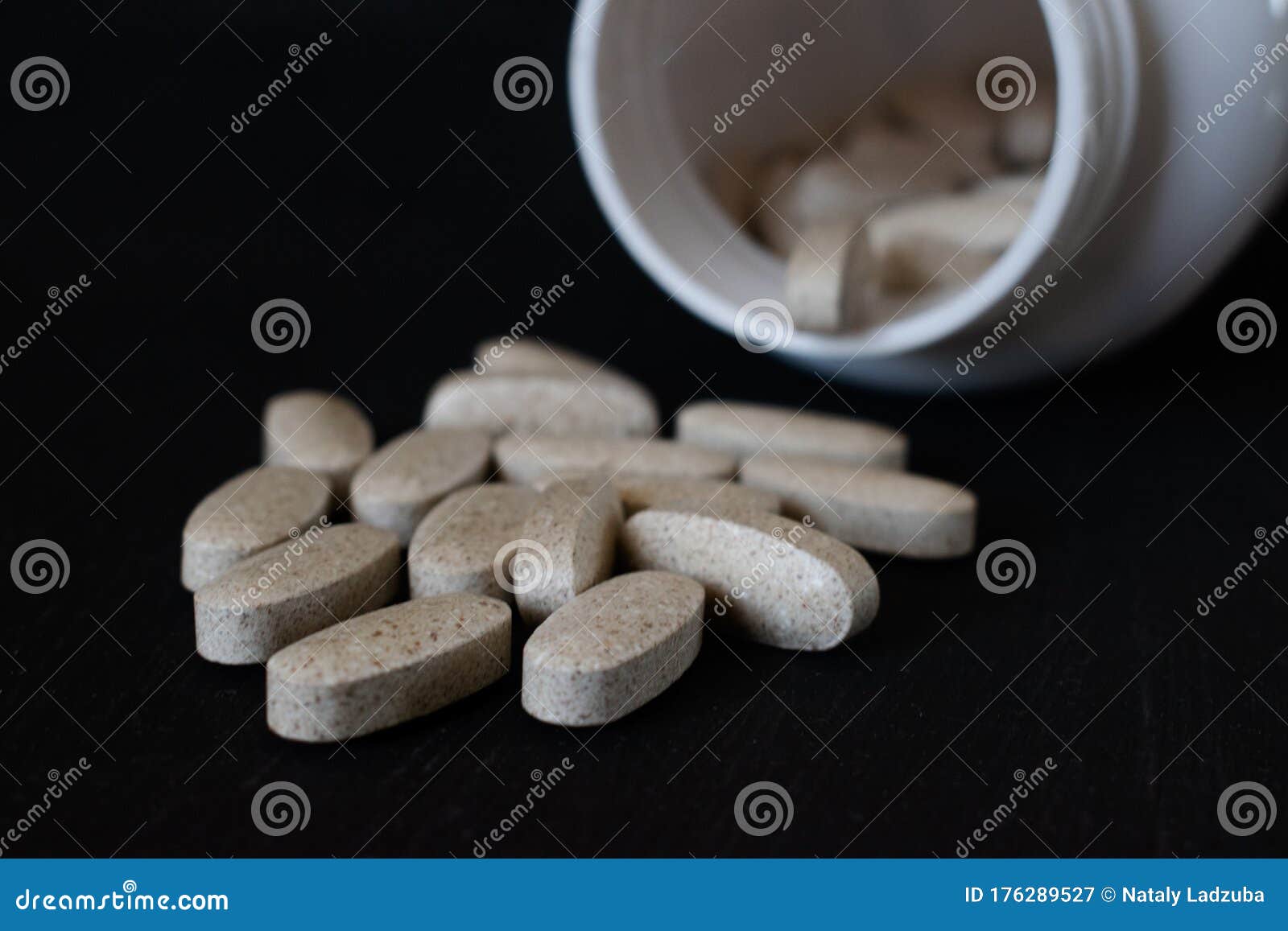 Vitamins in Large Tablets on a Black Surface Stock Image - Image of ...
