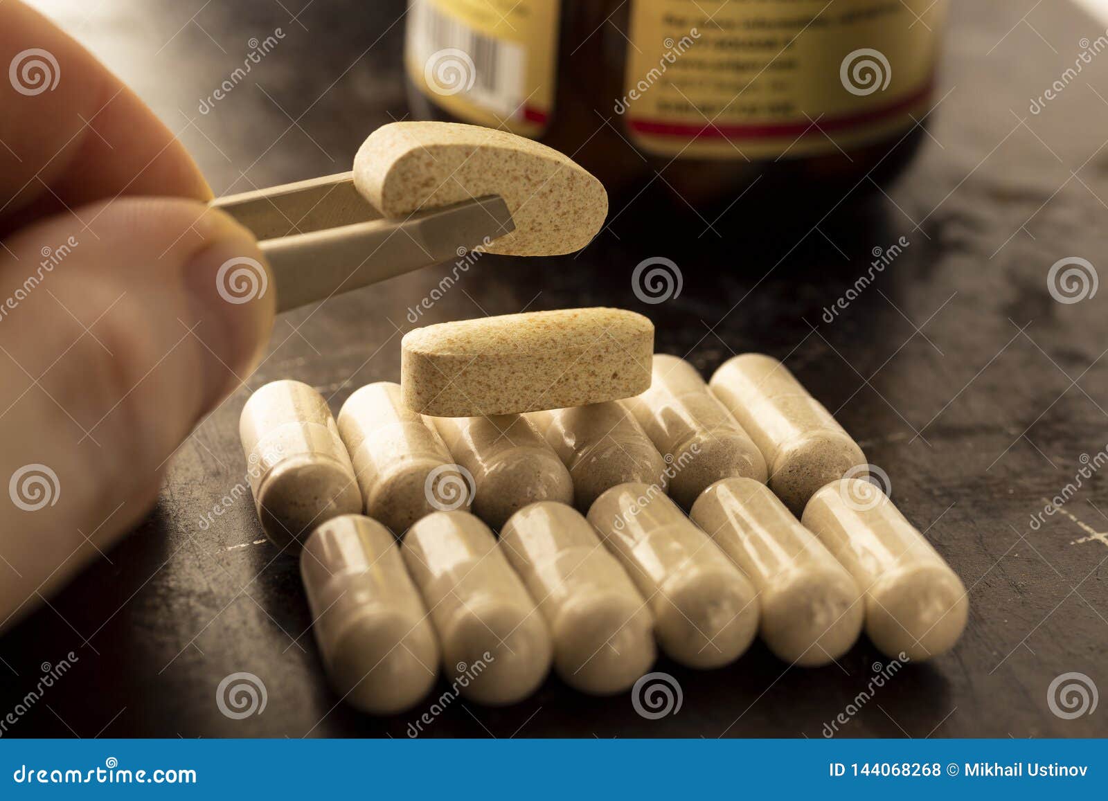 Vitamins in oval capsules stock photo. Image of care - 144068268
