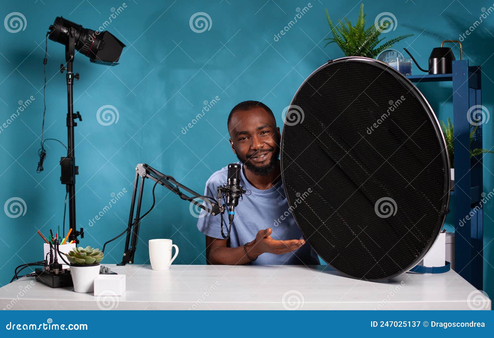 Vlogger Explaining Features of Studio Flash Light Modifier Sitting at ...