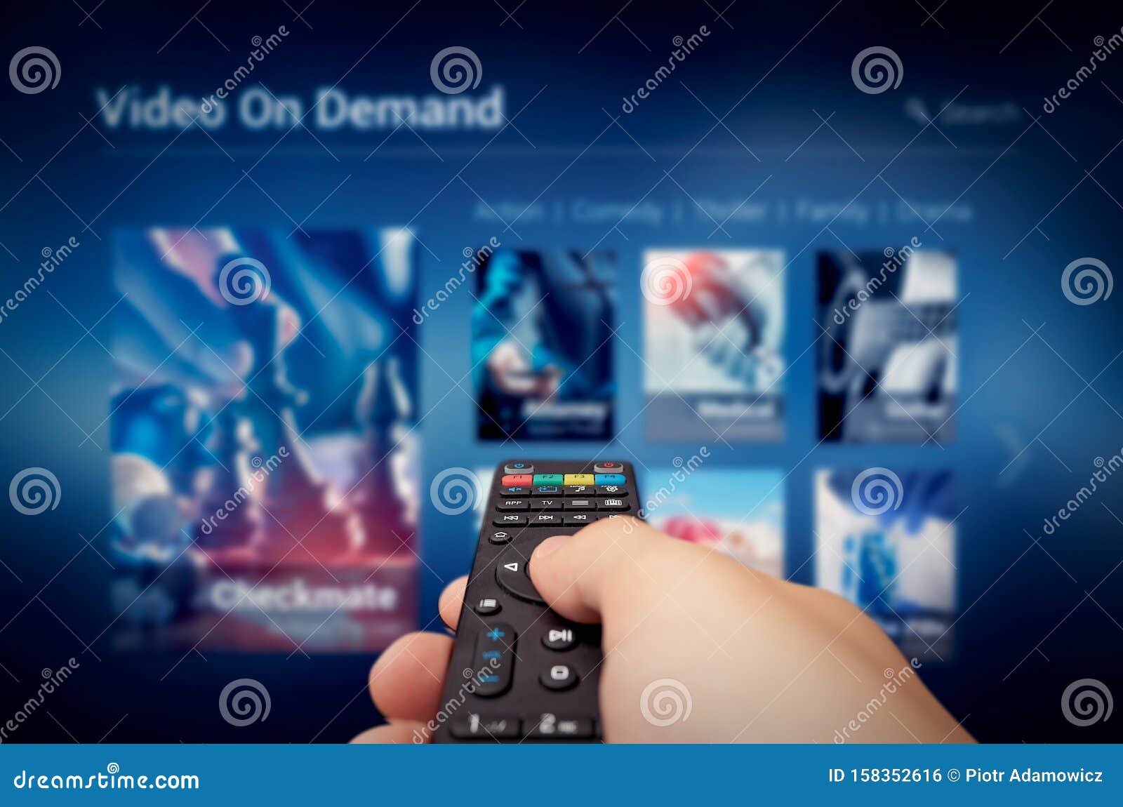 VOD Service Screen with Remote Control in Hand Stock Photo - Image of ...