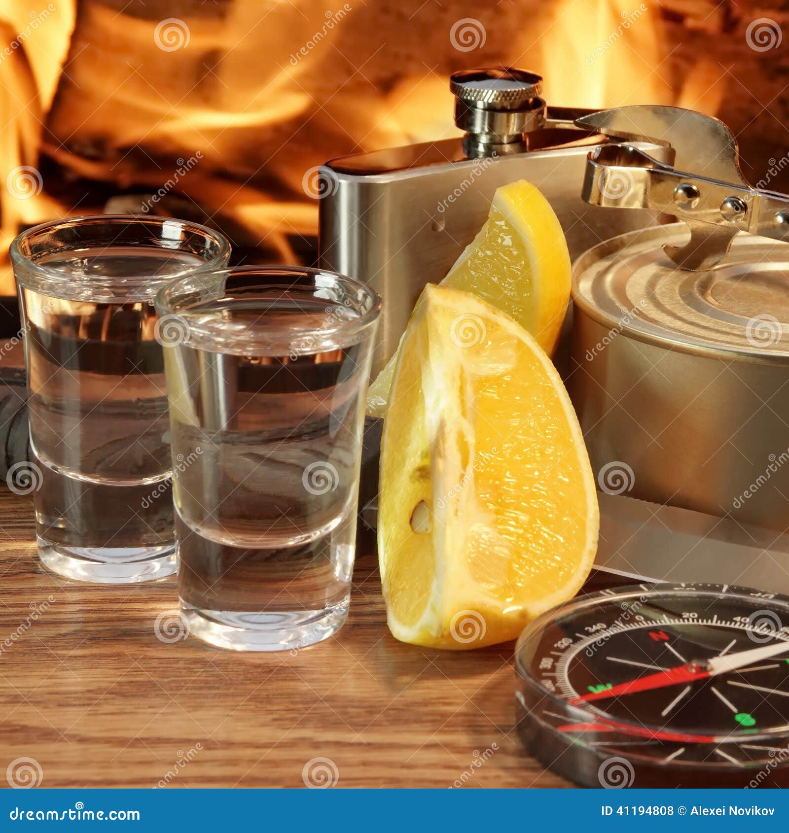 Vodka, Compass, Hip Flask and Food on the Board at Fire Stock Photo ...