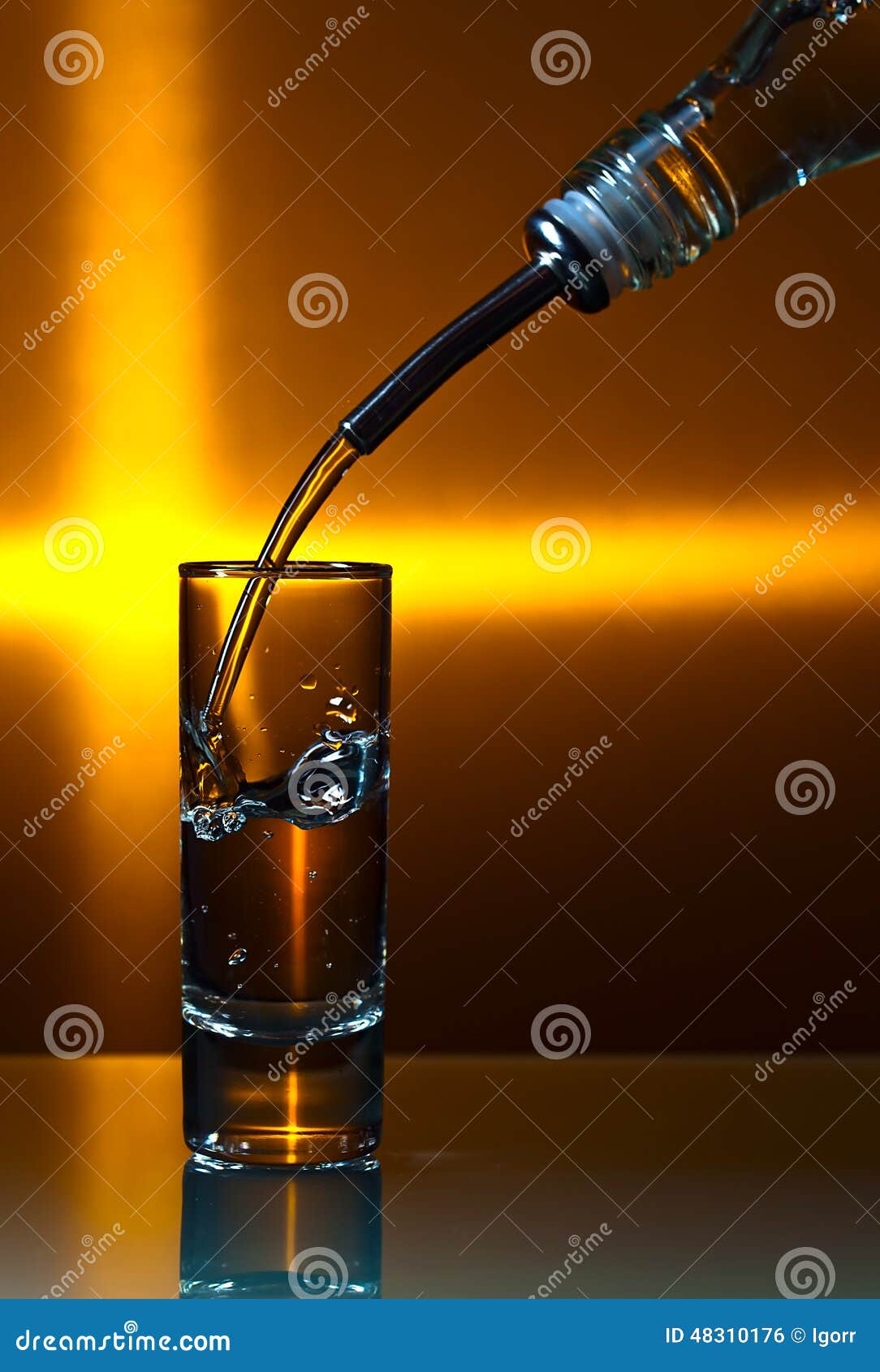 Vodka on glass table stock photo. Image of liquor, neat - 48310176