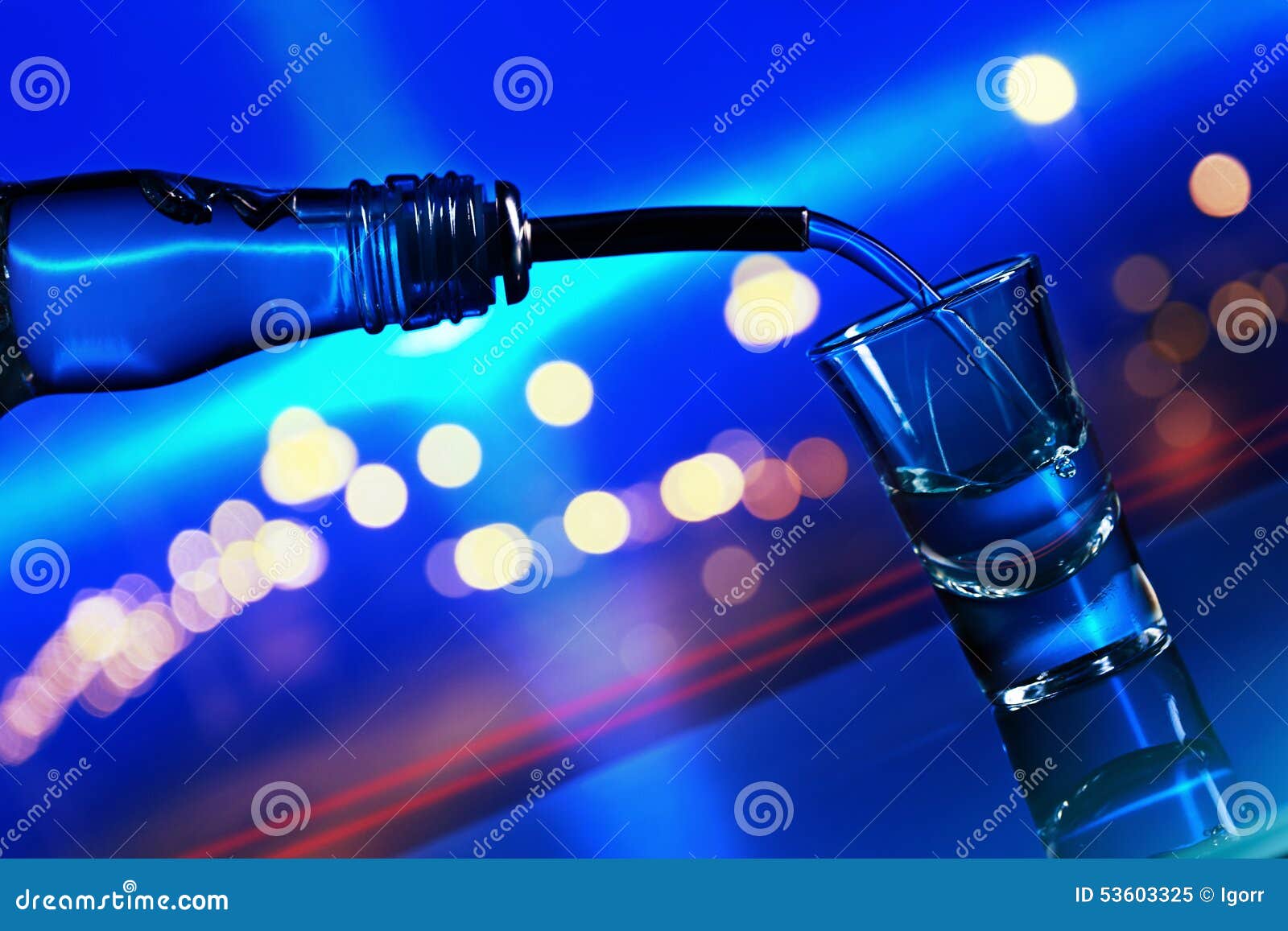 Vodka on glass table stock image. Image of pouring, liquor - 53603325