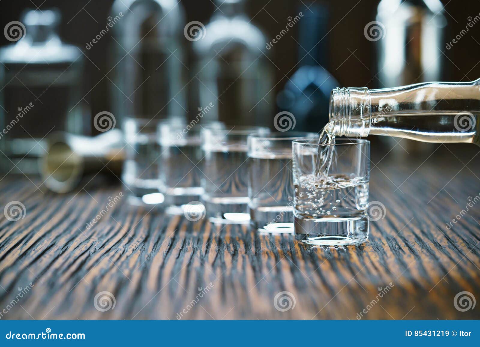 Vodka Pouring from the Bottle into Glass in a Bar, Selective Fo Stock ...