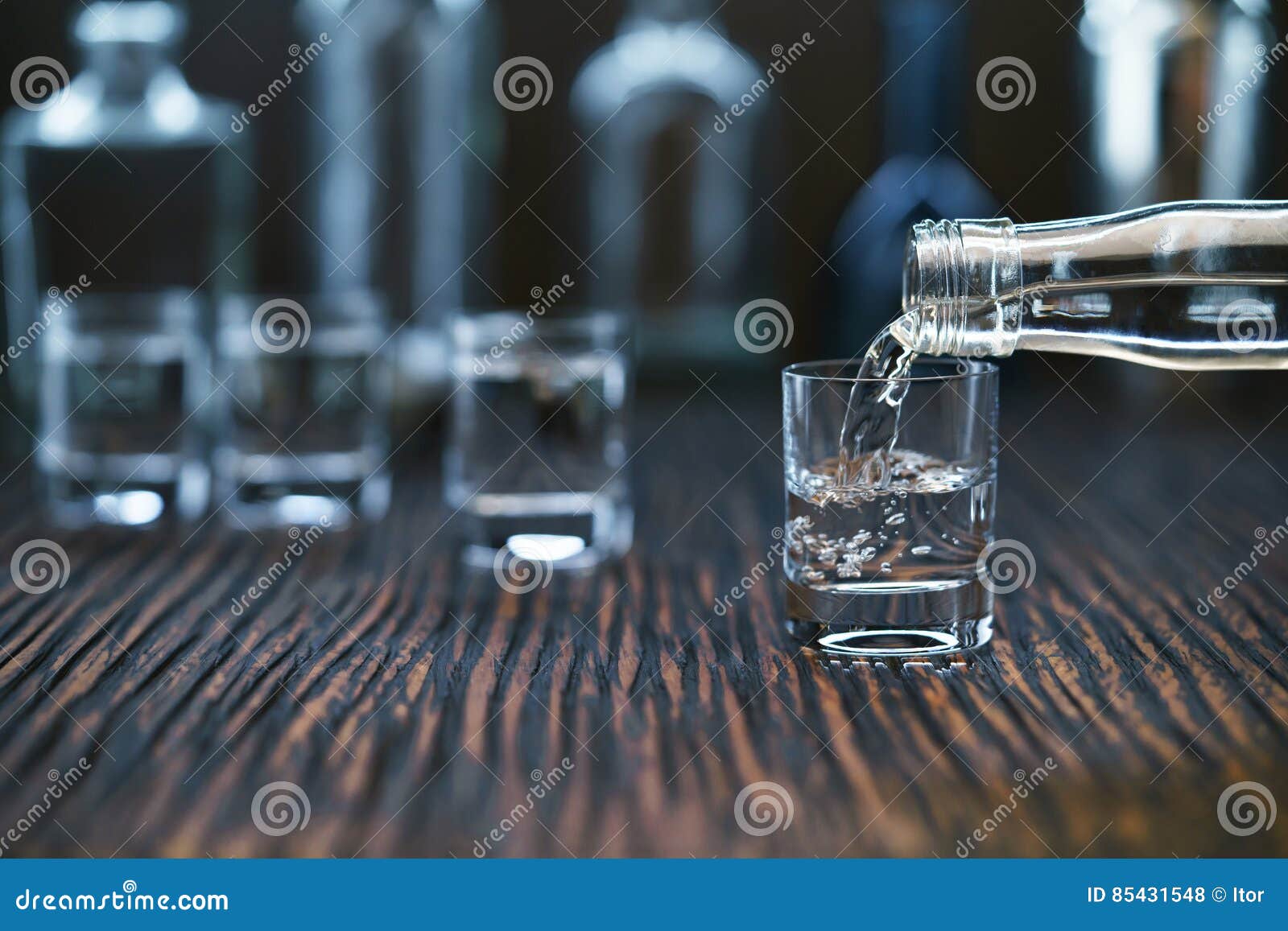 Vodka Pouring from the Bottle into Glass in a Bar, Selective Fo Stock ...