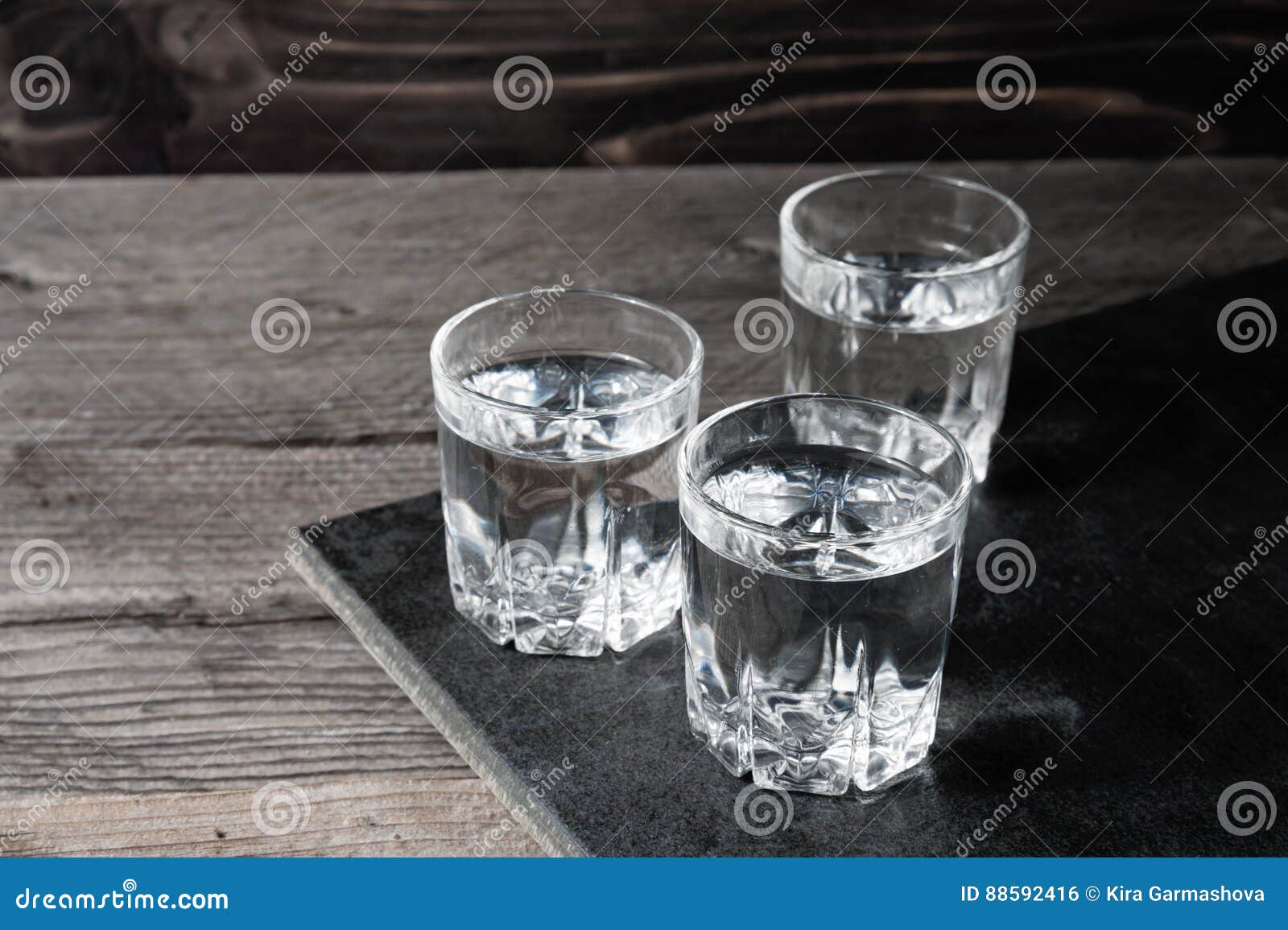 Vodka Shots with Ice Cubes on Black Stone, Stock Photo - Image of ...