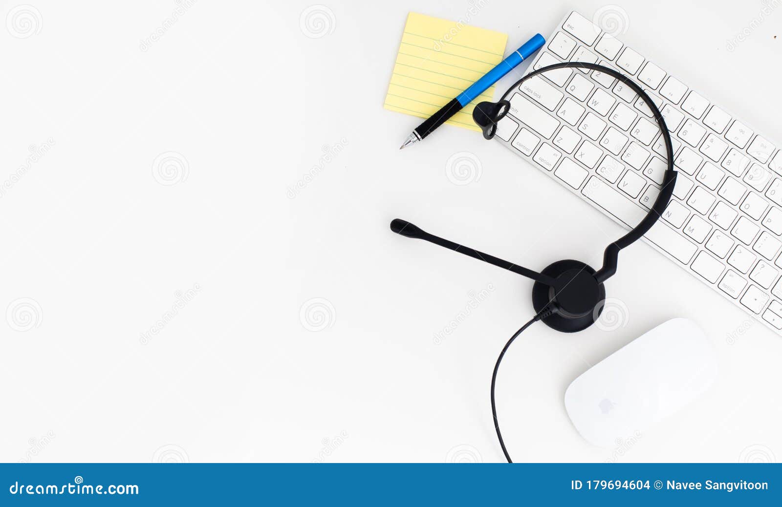 VOIP Headset, Pen and Paper Note on Laptop Computer Keyboard ...