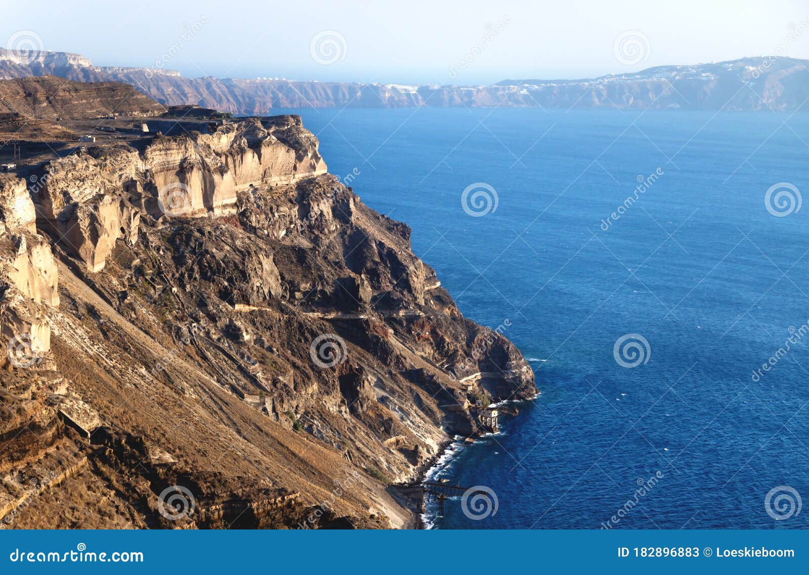 Volcanic Cliffs Along Deep Blue Ocean during Sunset, Santorini, Greece ...