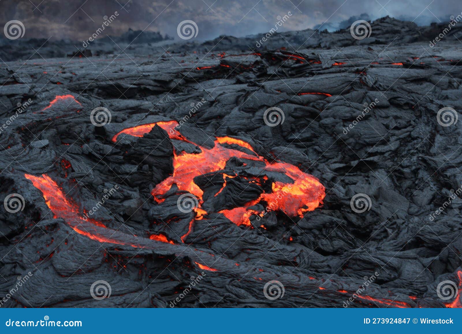 Volcanic Eruption with Glowing Orange Lava Flow Surrounded by a Pool of ...