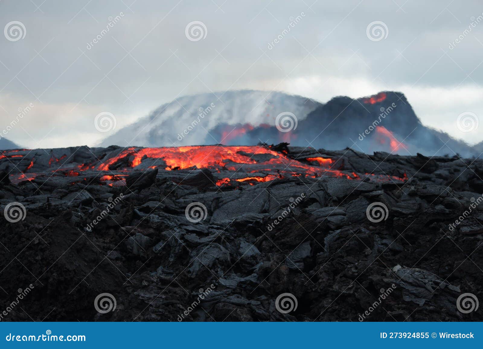 Volcanic Eruption with Glowing Orange Lava Flow Surrounded by a Pool of ...