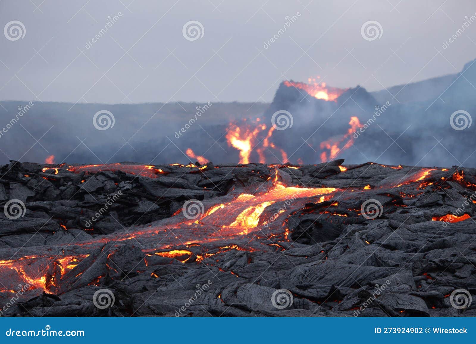 Volcanic Eruption with Glowing Orange Lava Flow Surrounded by a Pool of ...