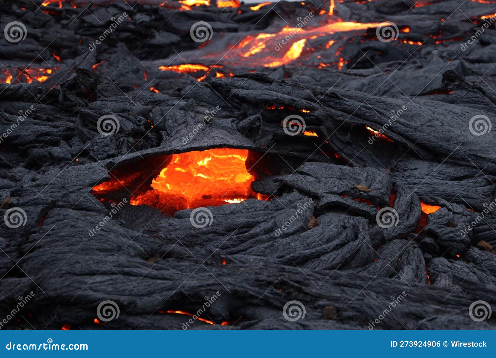 Volcanic Eruption with Glowing Orange Lava Flow Surrounded by a Pool of ...