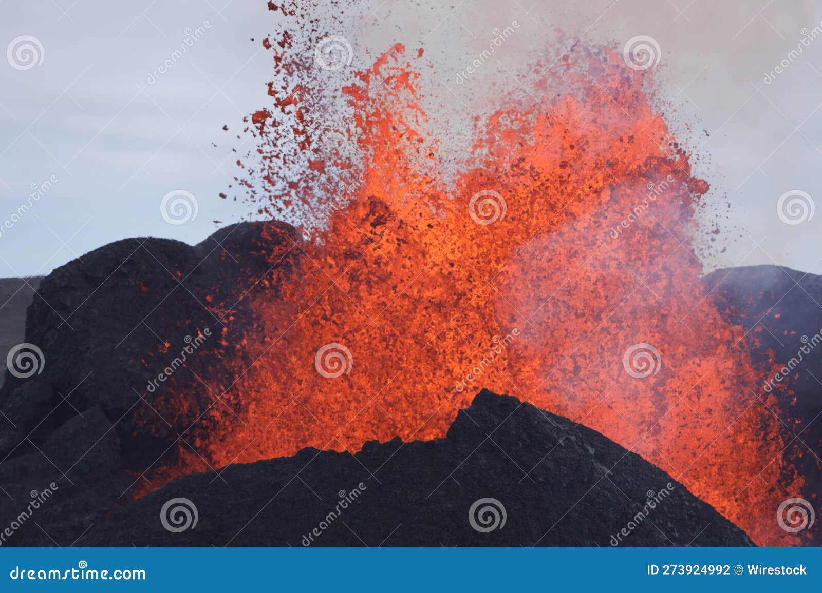 Volcanic Eruption with Glowing Orange Lava Flow Surrounded by a Pool of ...
