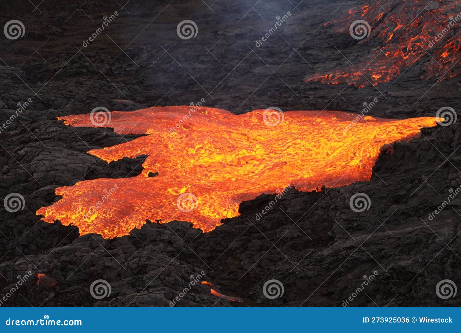 Volcanic Eruption with Glowing Orange Lava Flow Surrounded by a Pool of ...