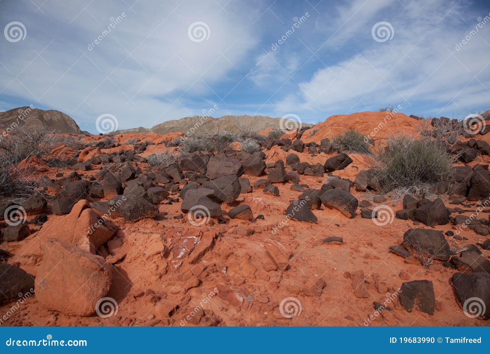 Volcanic Rocks on Orange Desert. Stock Photo - Image of black, blue ...
