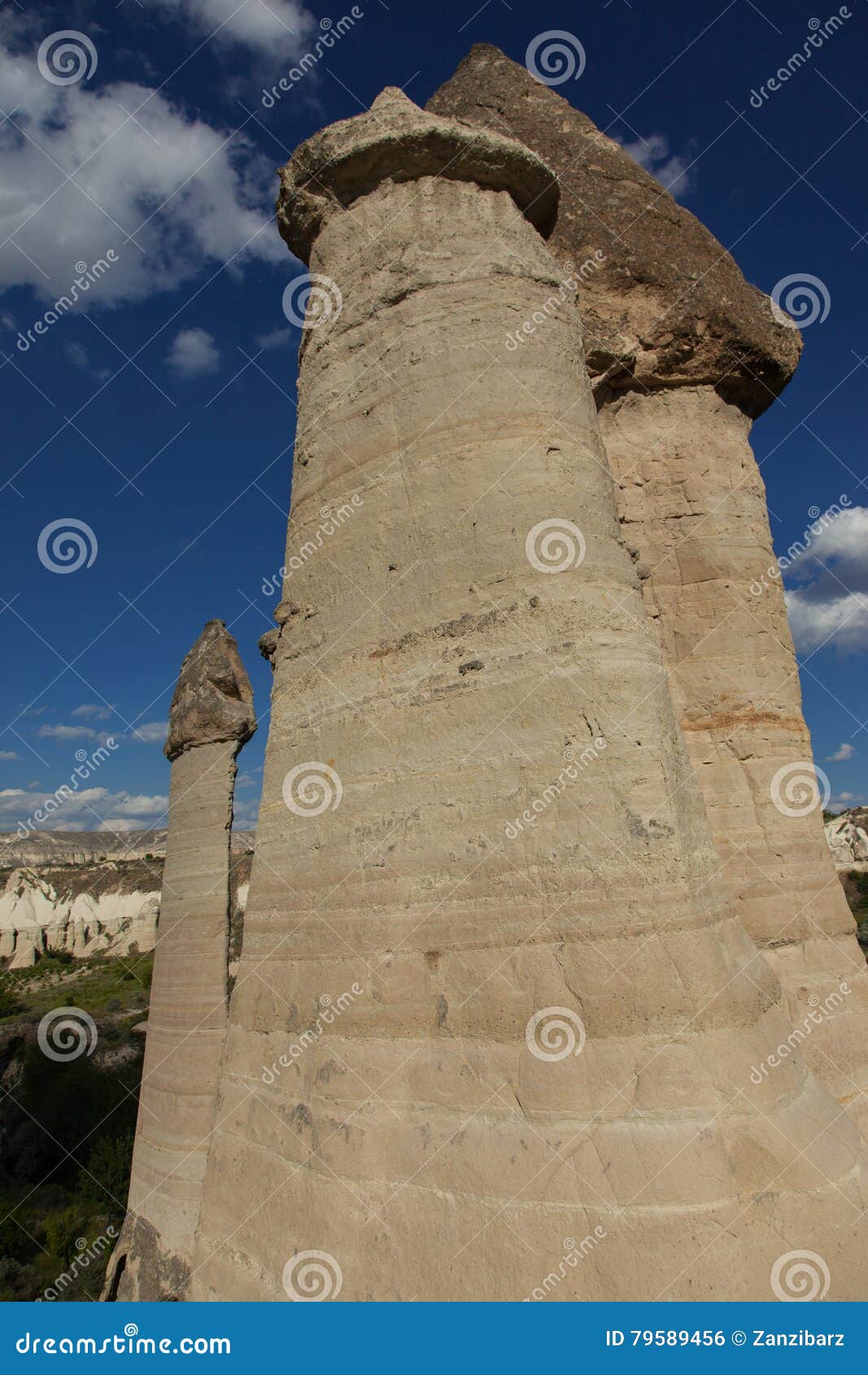 Volcanic Tall Rock Formations in Front of Sky in Cappadocia Stock Photo ...