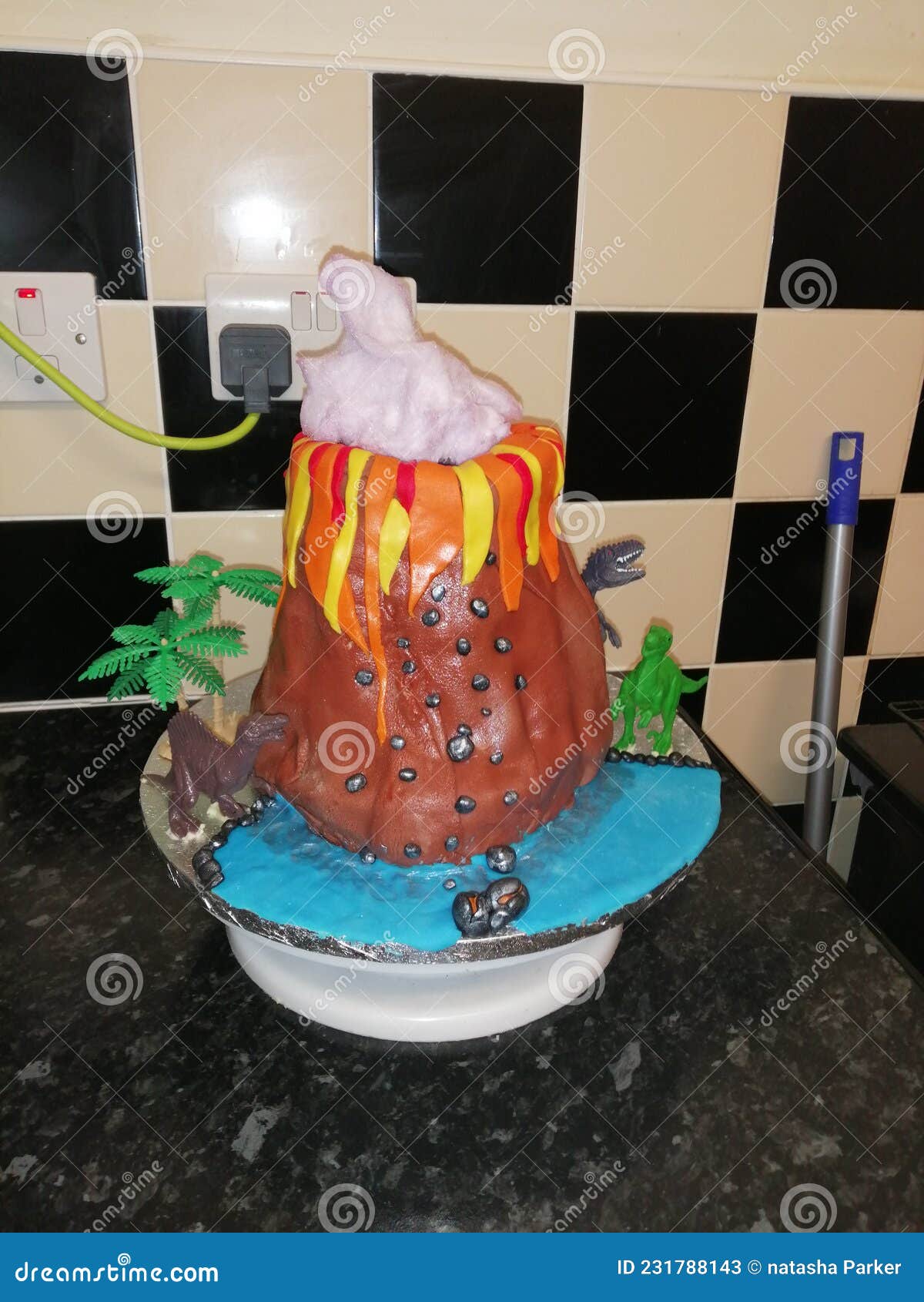 Volcano birthday cake stock image. Image of blue, torte - 231788143