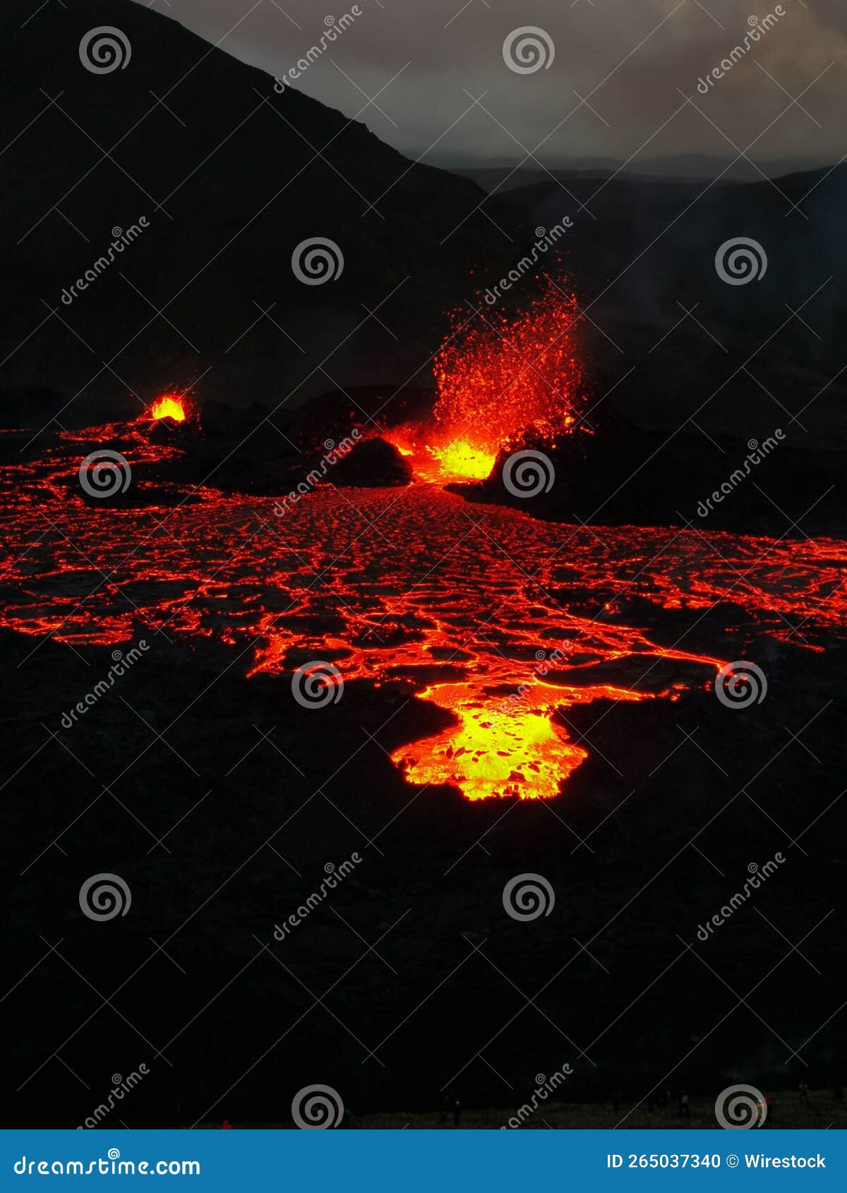 Volcano with Lava Pouring into the Air from a Crater Stock Photo ...