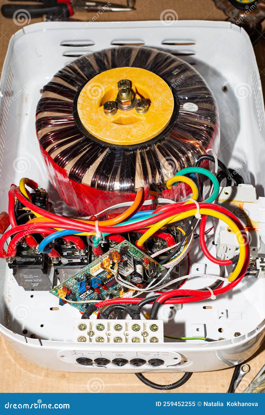 Voltage Stabilizer Repair. Multi-colored Wires in a White Casing of the ...