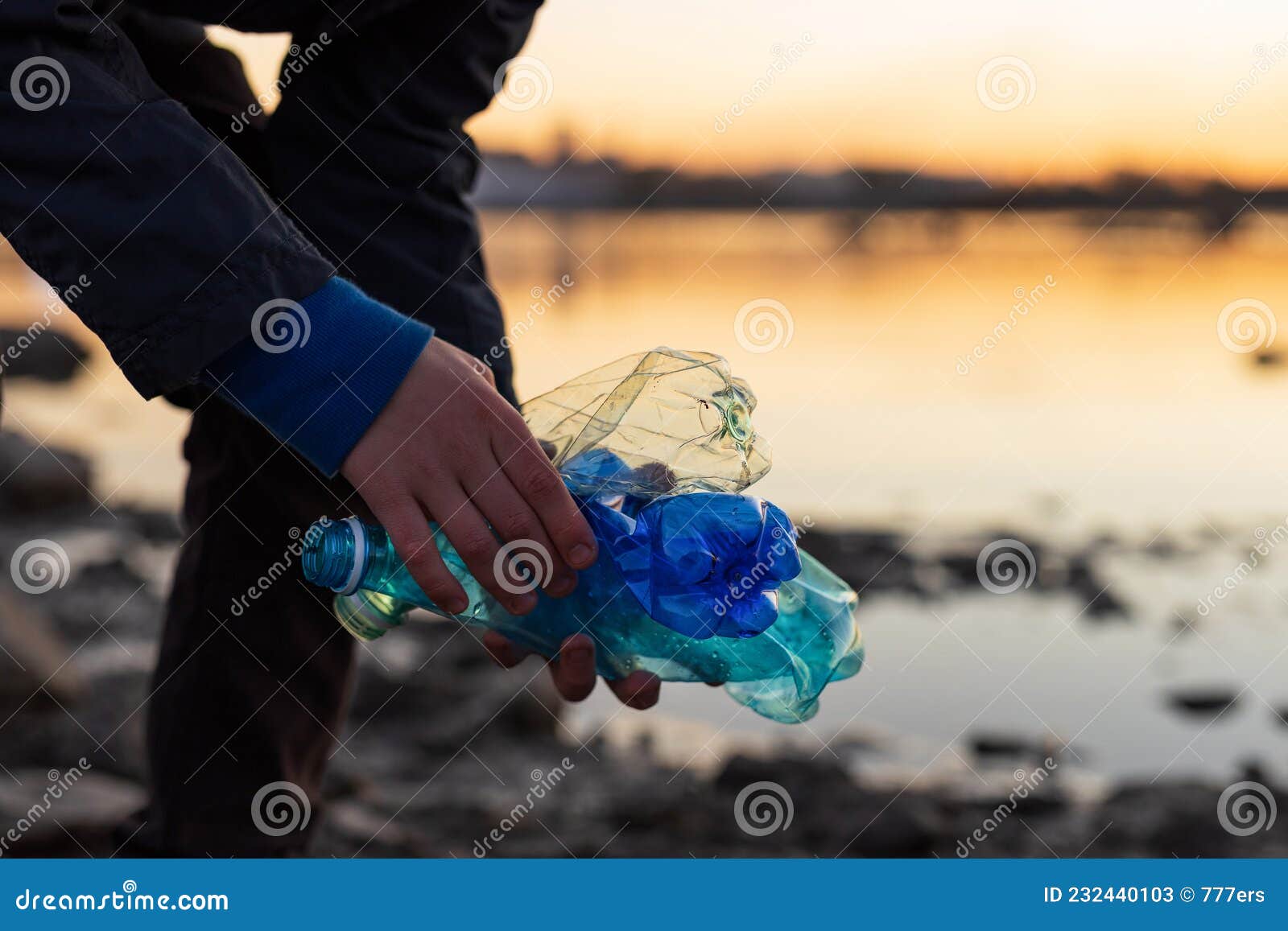 A Volunteer Collecting Plastic on the Shore. Sustainable Development ...