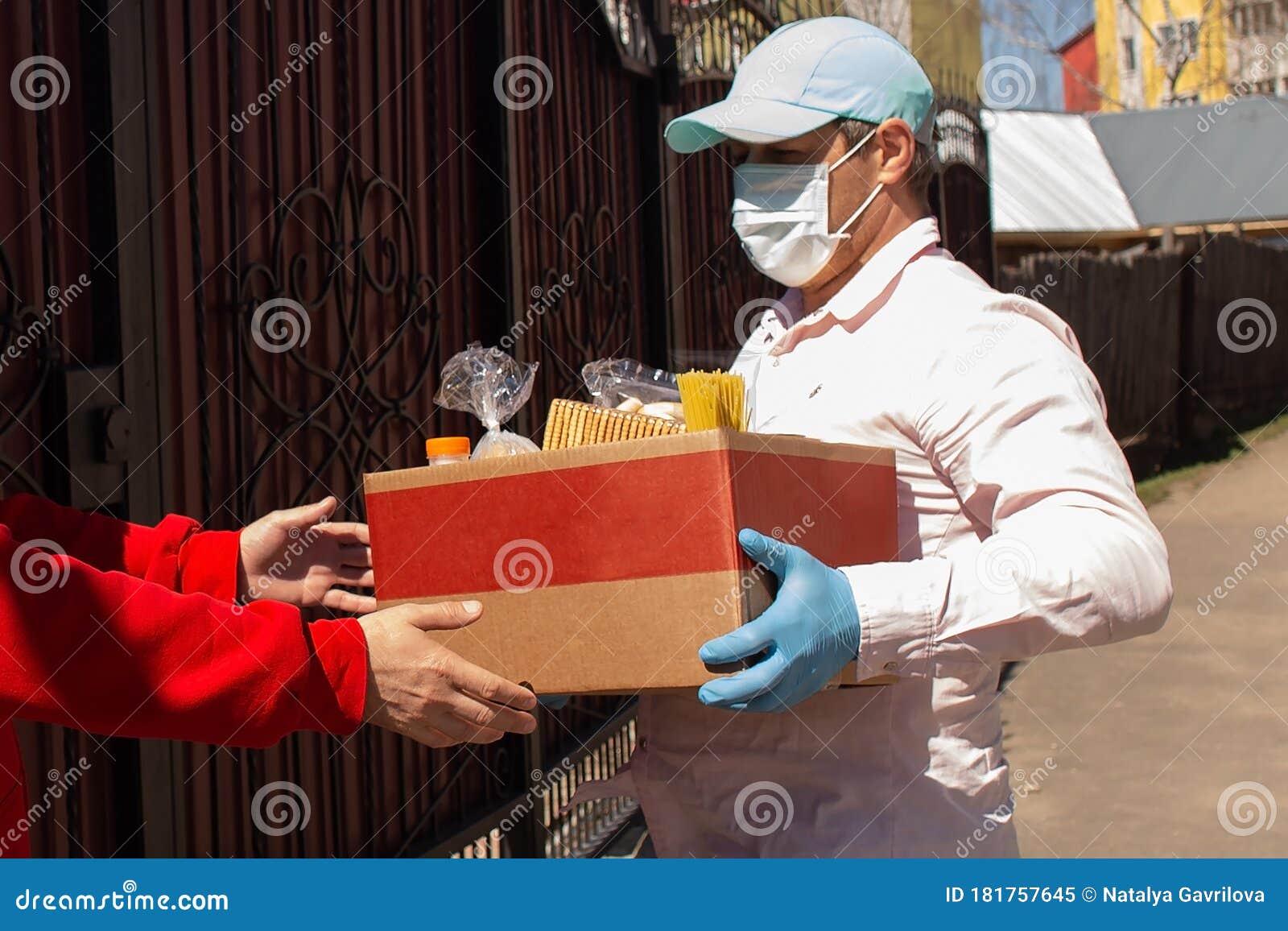 Volunteer Hands Over a Box of Food To those in Need Stock Image - Image ...