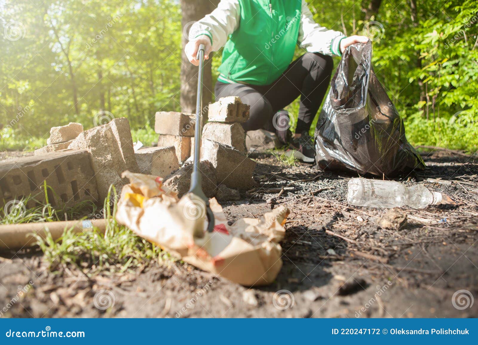 Volunteer Picking Trash in the Forest Stock Photo - Image of stick ...
