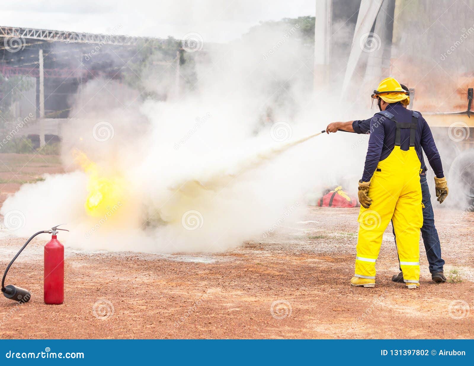 Volunteer Using Fire Extinguisher from Hose for Fire Fighting during ...
