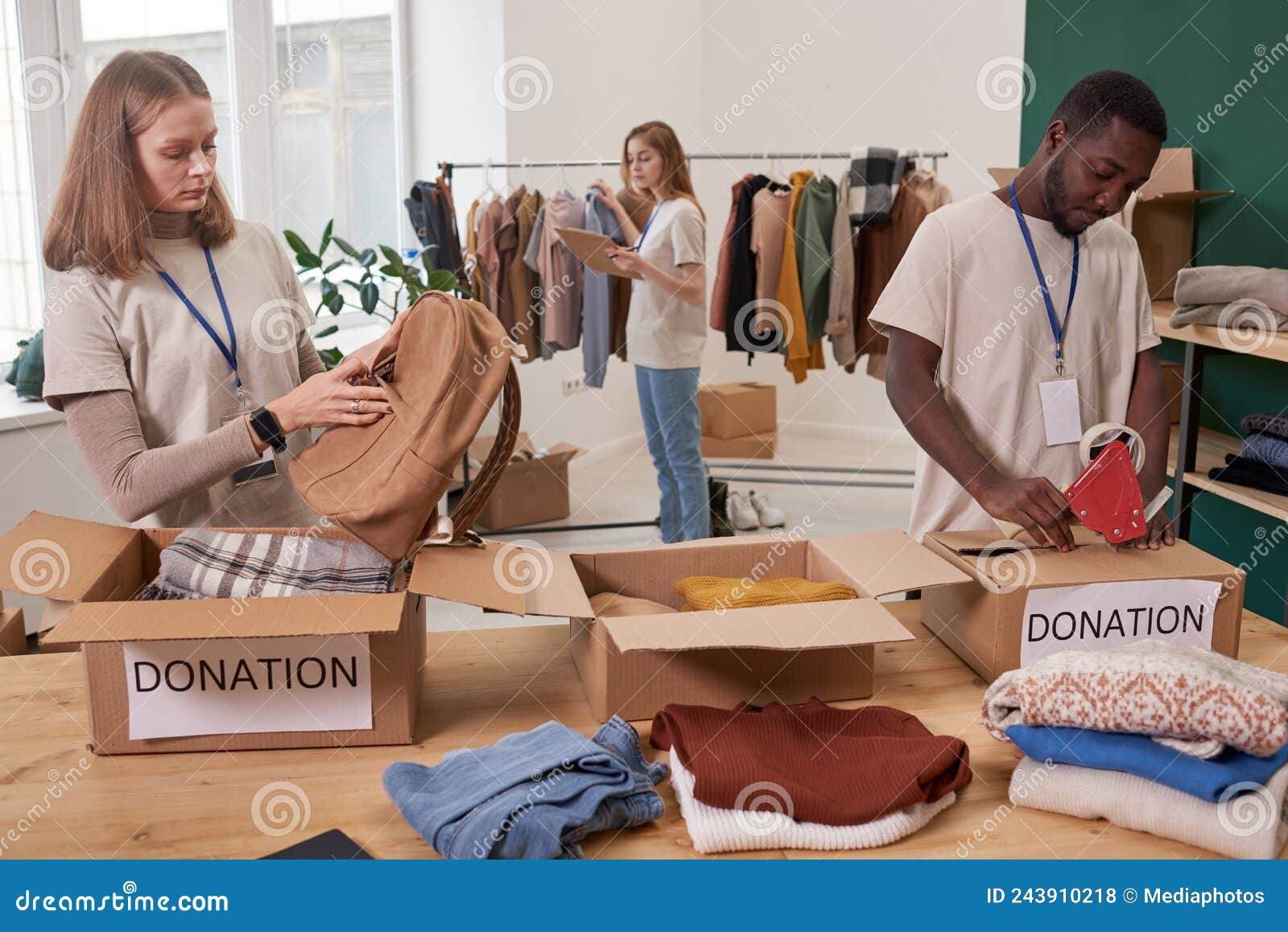 Volunteering in Clothes Charity Stock Photo - Image of lifestyles ...