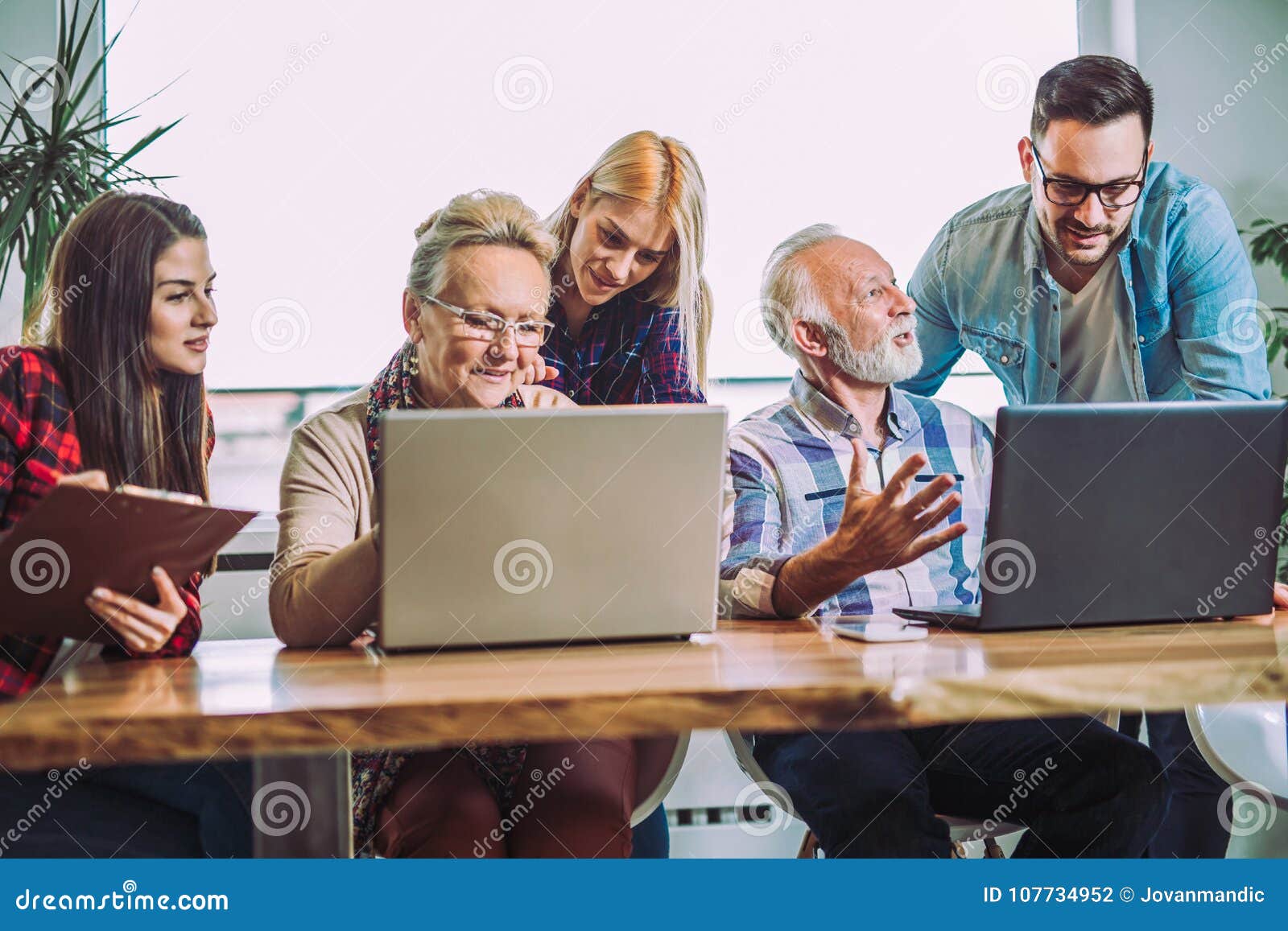 Volunteers Help Senior People on the Computer Stock Photo - Image of ...