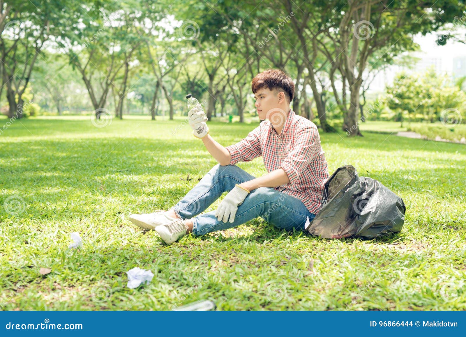 Volunteers Picking Up Litter In The Park. Father And His Toddler Son ...