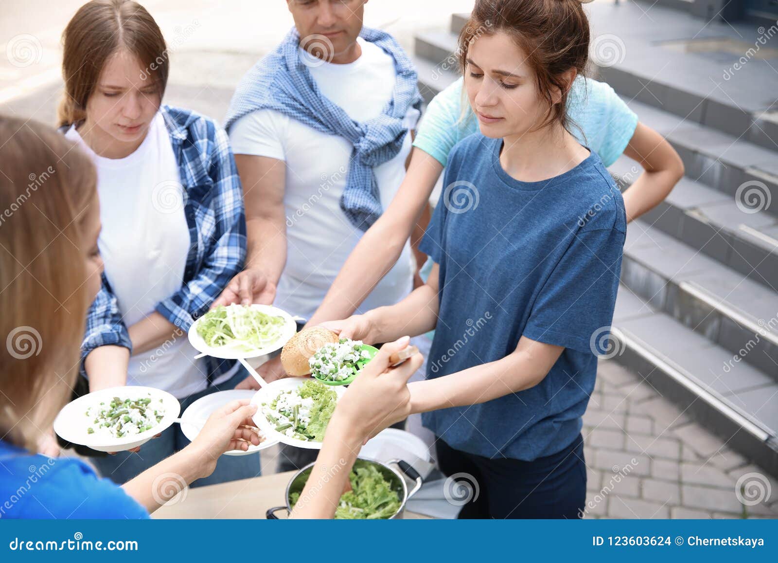 Volunteers Serving Food for Poor People Stock Photo - Image of needy ...