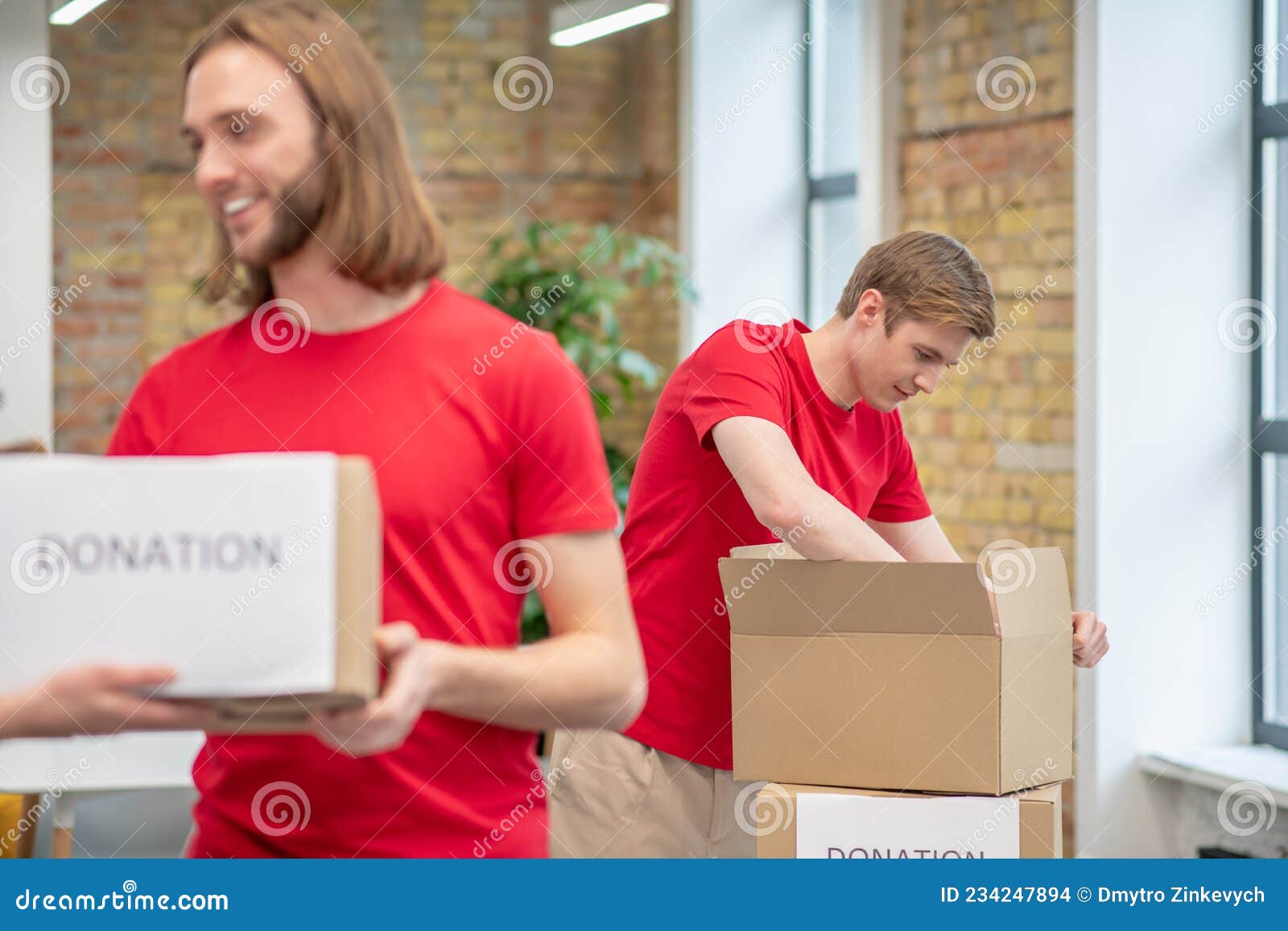 Volunteers Working in a Sorting Point and Looking Busy Stock Photo ...