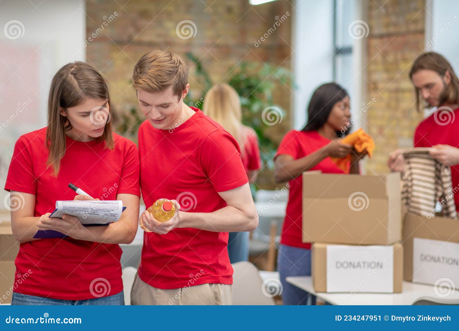 Volunteers Working in a Sorting Point and Looking Busy Stock Image ...