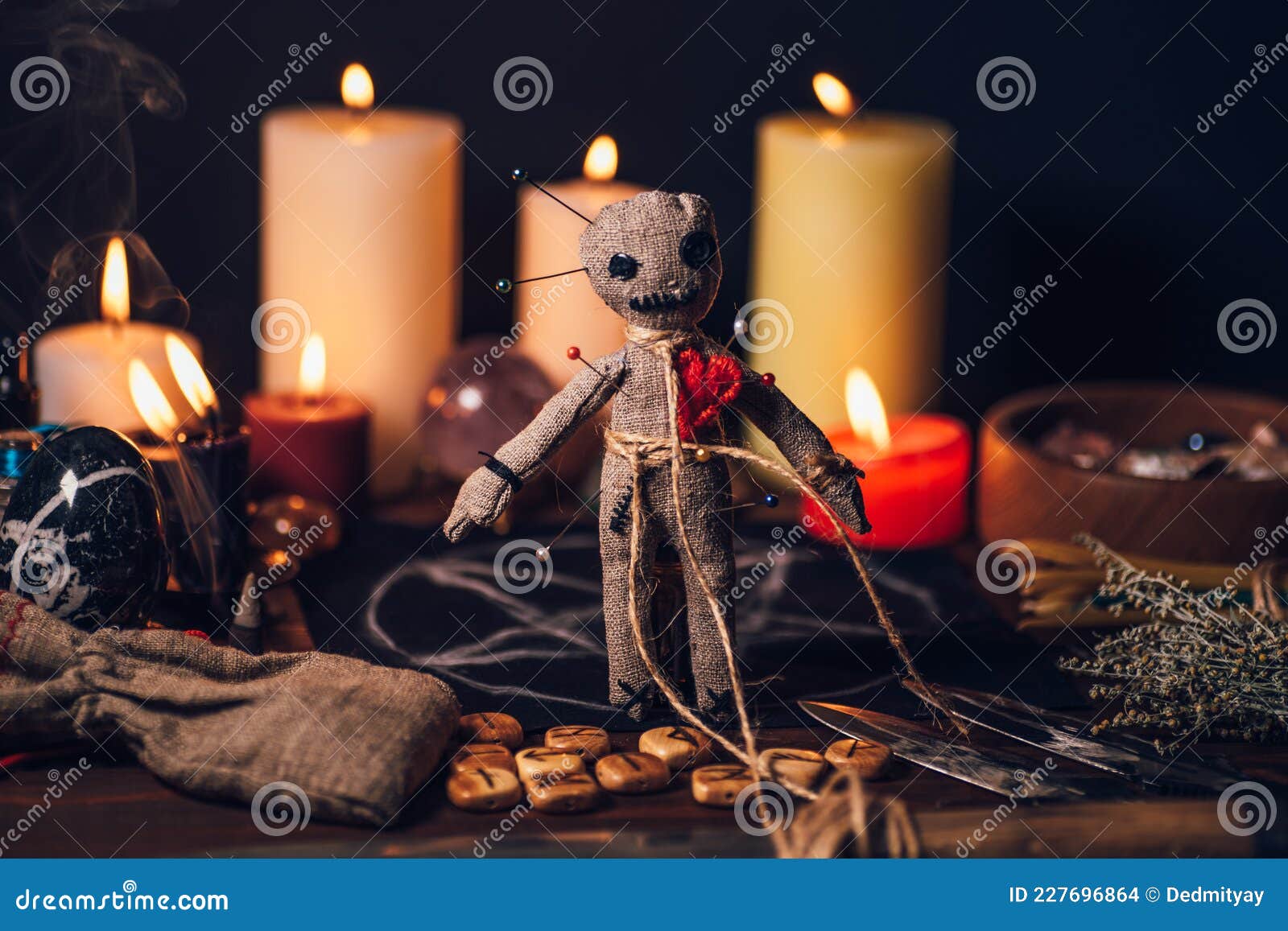 Voodoo Doll on a Magic Table with Esoteric Objects and Burning Candles ...